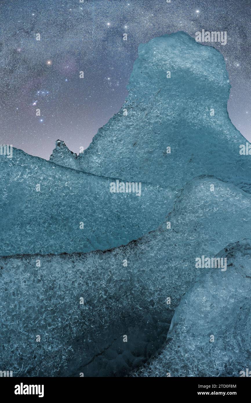 Serene night sky filled with stars hovers over the textured surfaces of ...