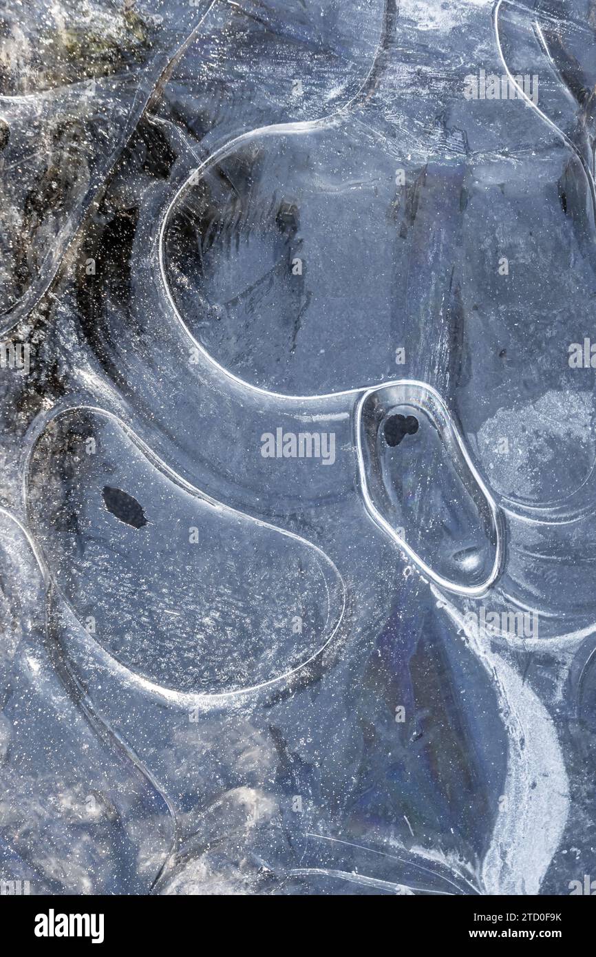 Intricate frozen water forms abstract shapes with a blend of smooth ...