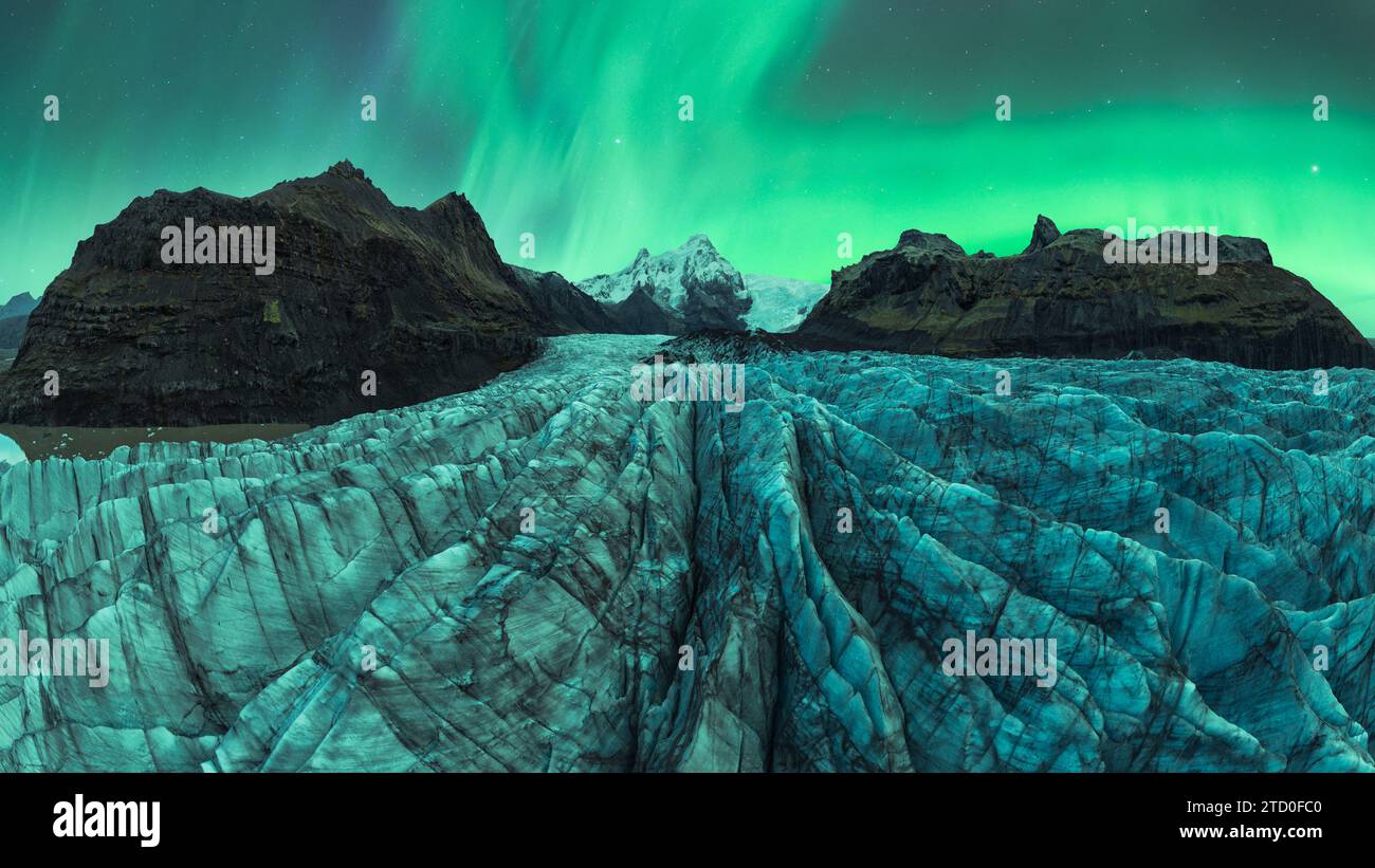 A stunning view of a sprawling glacier set against the ethereal dance ...