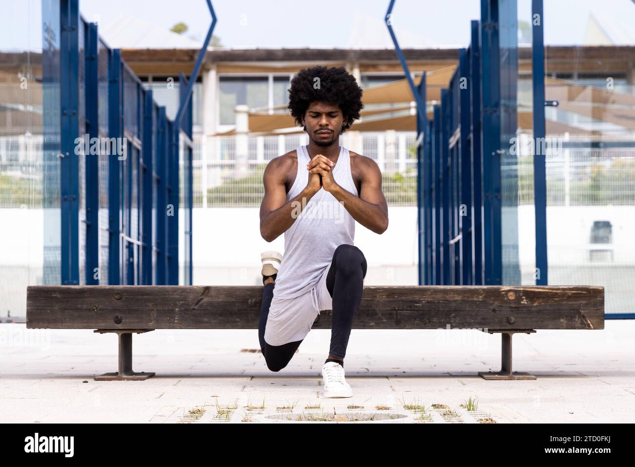 Full body of determined African American male athlete with hands ...