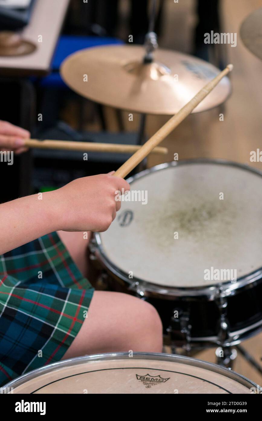 Students in a classroom learning how to play musical instruments Stock ...