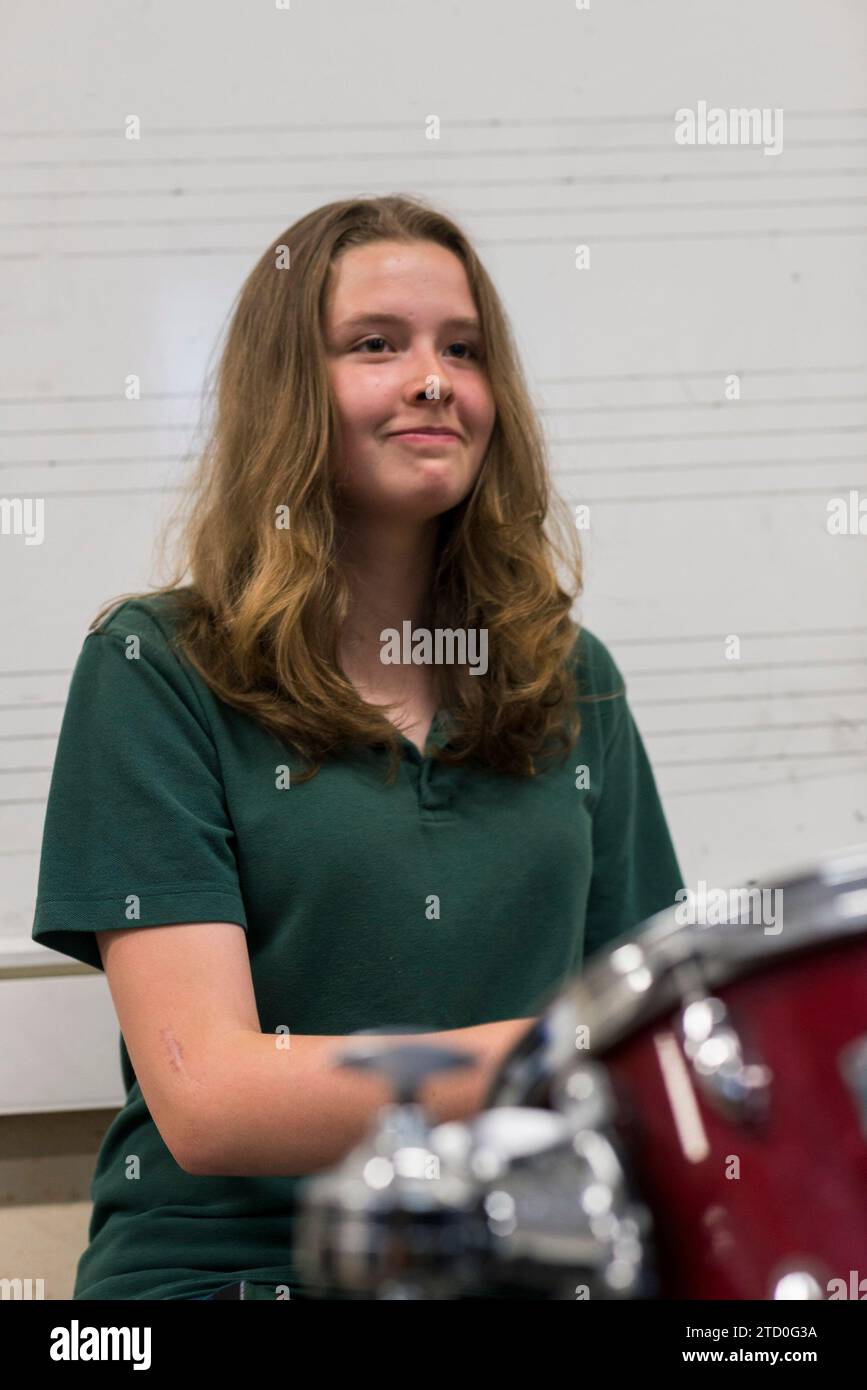 Students in a classroom learning how to play musical instruments Stock ...