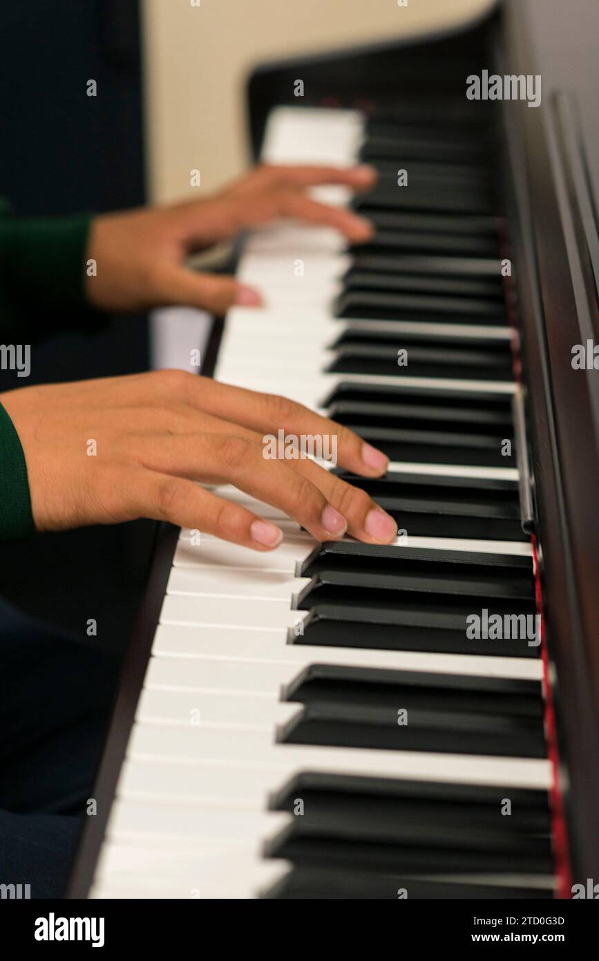 Students in a classroom learning how to play musical instruments Stock ...