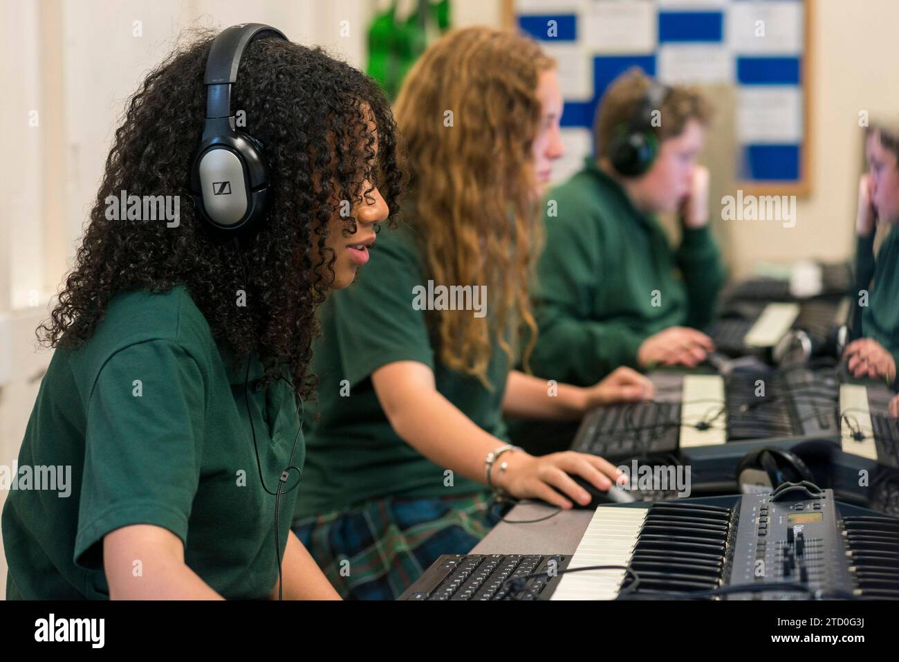 Students in a classroom learning how to play musical instruments Stock ...