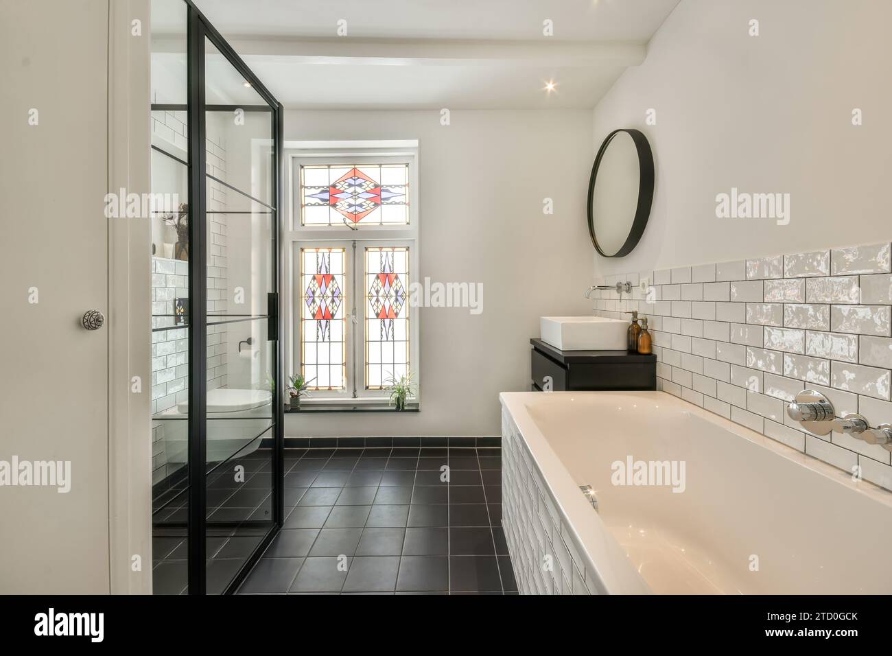 Shower booth and bathtub in luxurious bathroom of modern house with ...