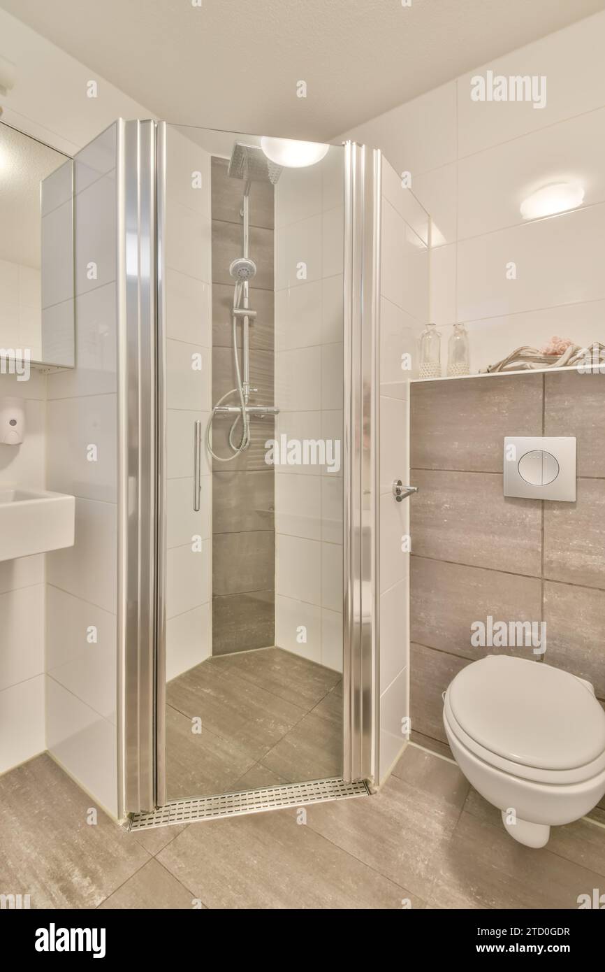 Shower booth and toilet seat in modern bathroom of luxurious apartment ...