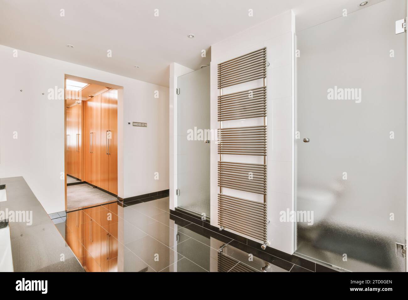 Closed glass door of shower booth in luxurious bathroom of modern home ...