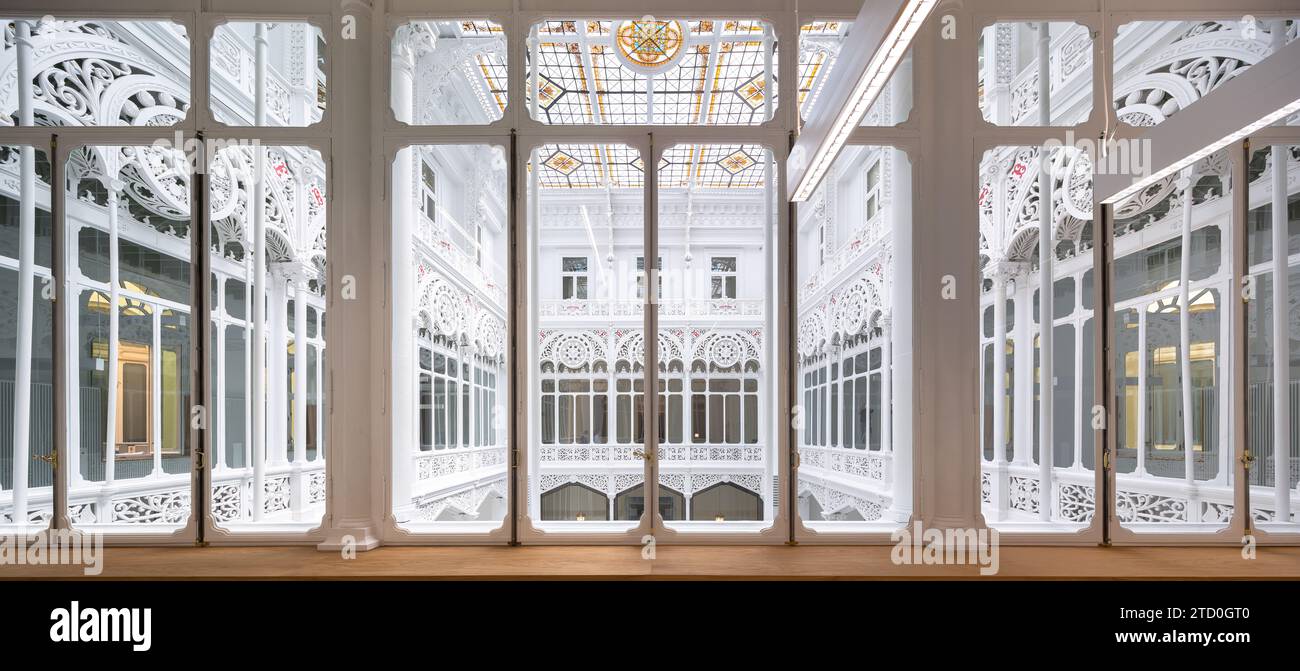Interior of modern hallway with hanging light with large glass door and ...
