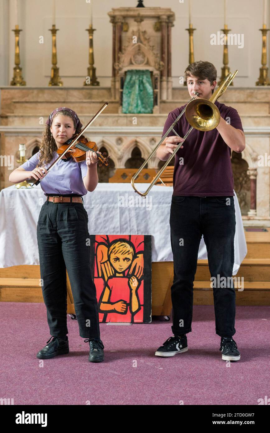 Students in a classroom learning how to play musical instruments Stock ...