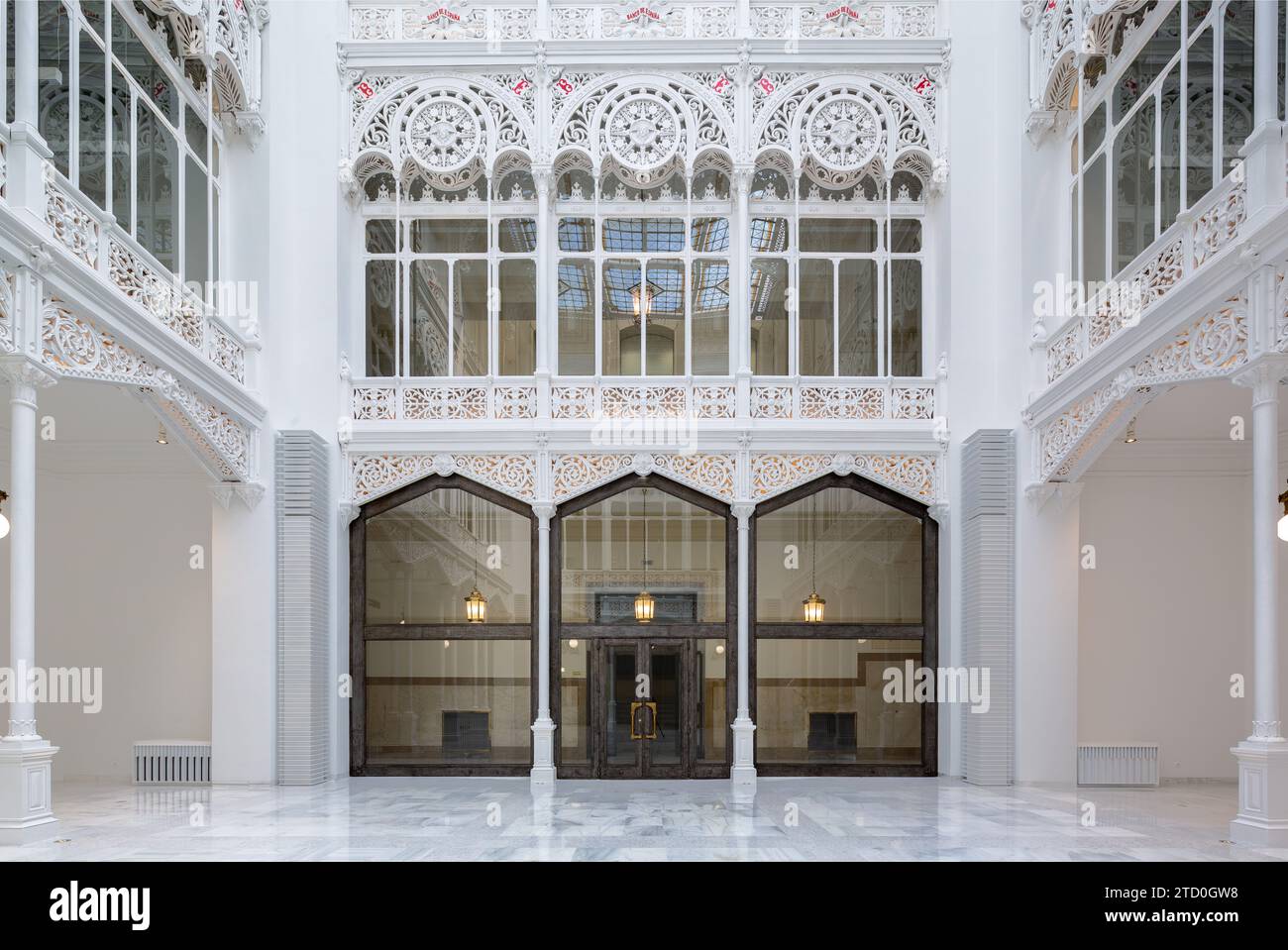 Bright white empty library hallway with skylight and lights hanging in ...