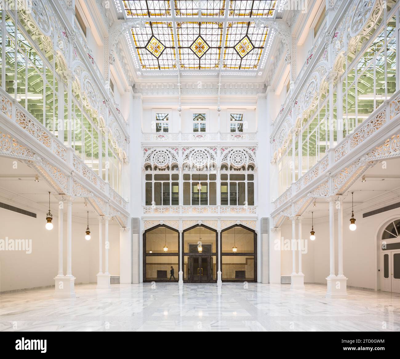 Bright white empty library hallway with skylight and lights hanging in ...