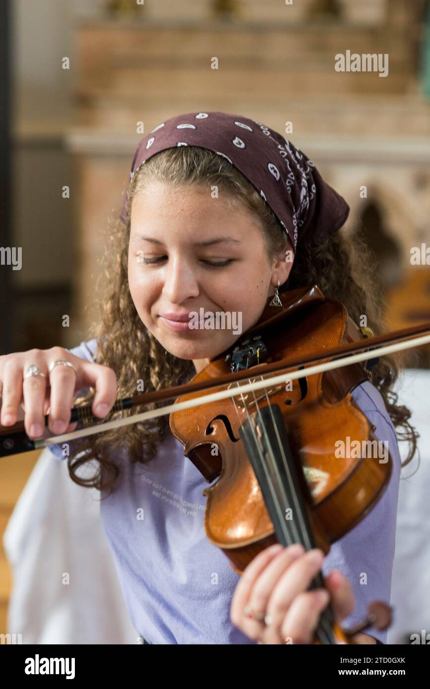 Students in a classroom learning how to play musical instruments Stock ...