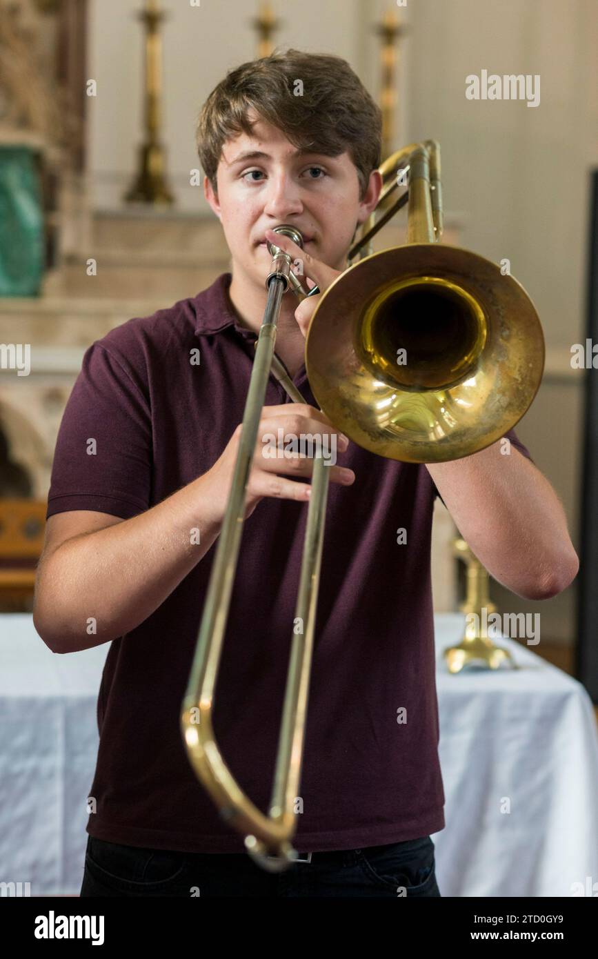 Students in a classroom learning how to play musical instruments Stock ...