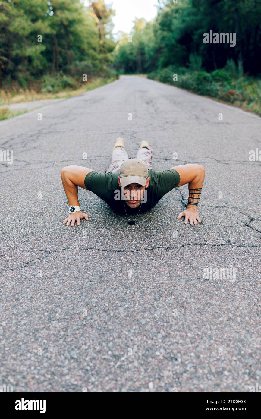 Full body of active middle aged military soldier wearing cap and ...