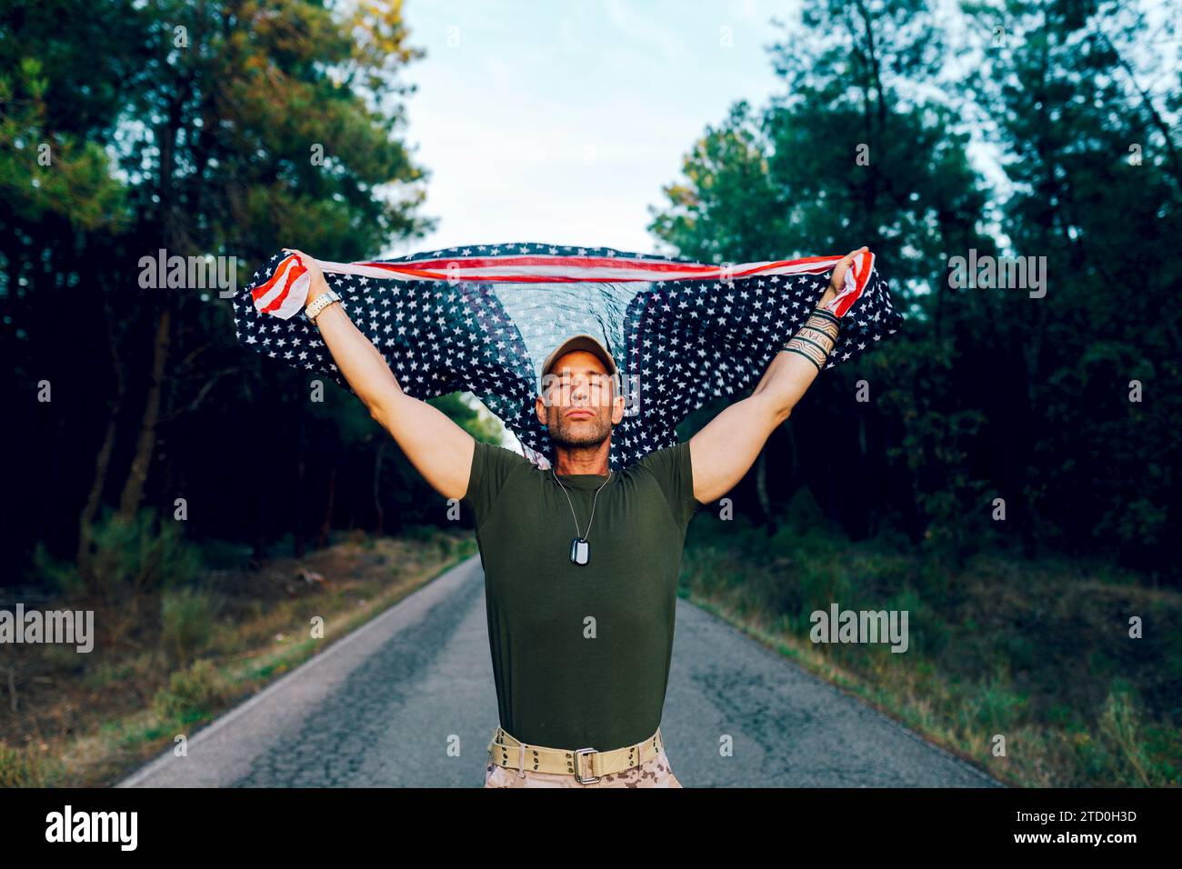 Middle aged special force commando wearing uniform with eyes closed ...