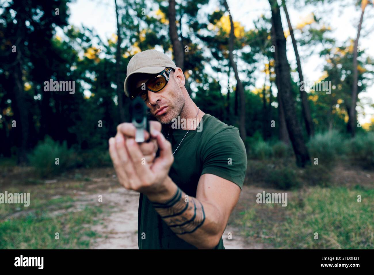 Middle aged special force army commando in cap and glasses looking at ...