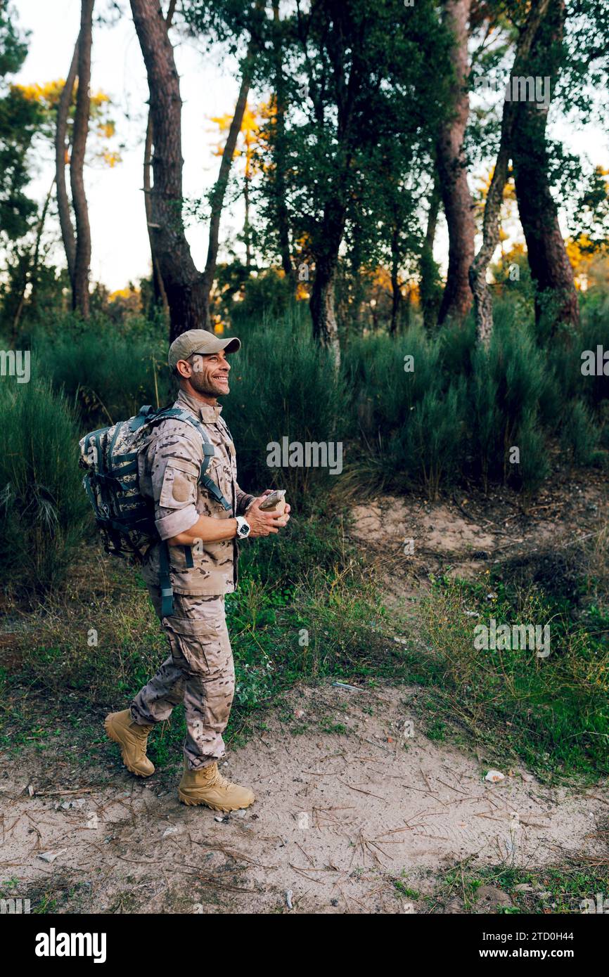 Side view of happy mature special force military soldier wearing ...