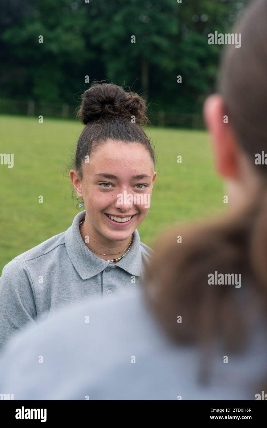 Boy and girl talking outside school hi-res stock photography and images ...
