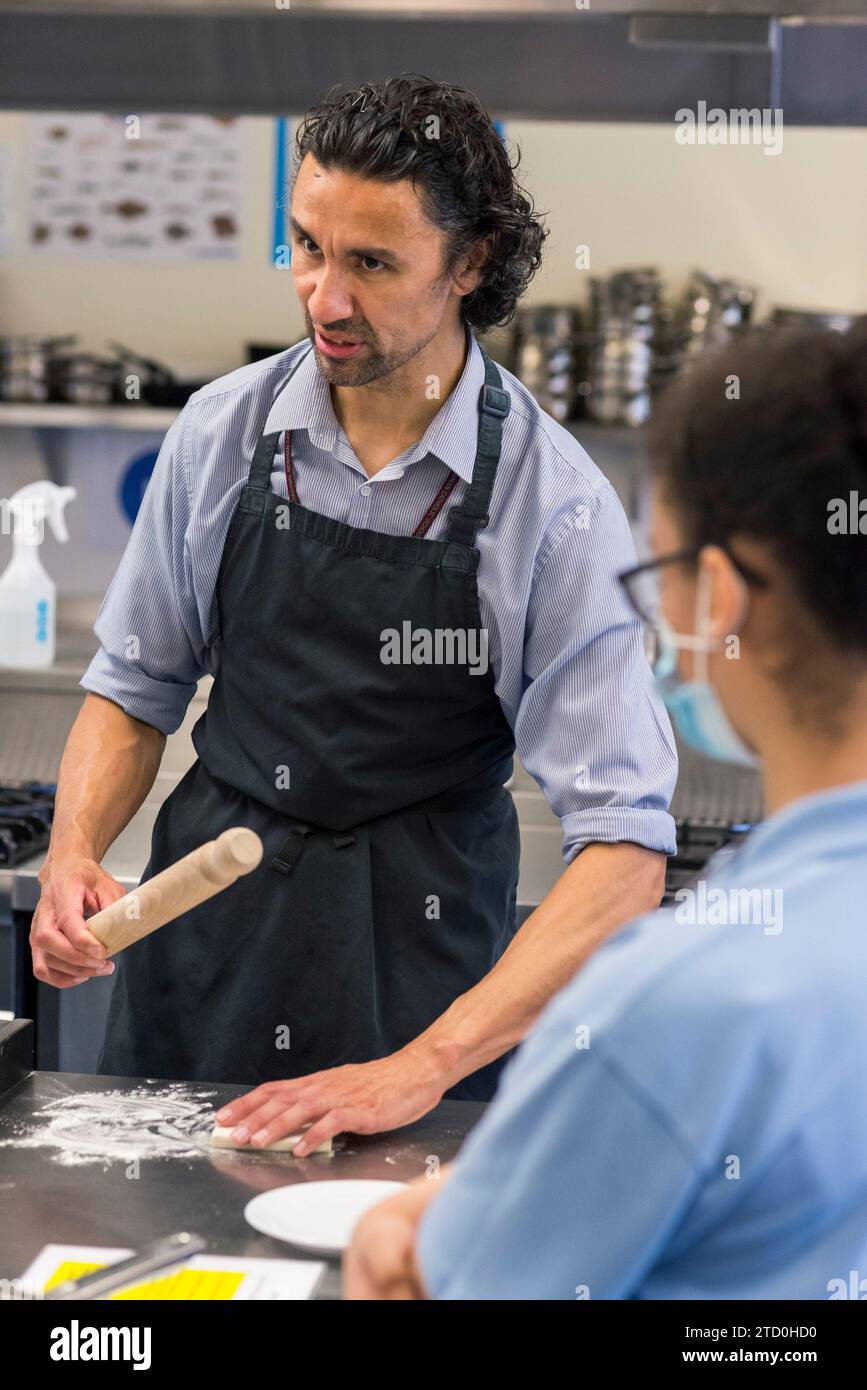 Students studying food technology for GCSE and working preparing food ...
