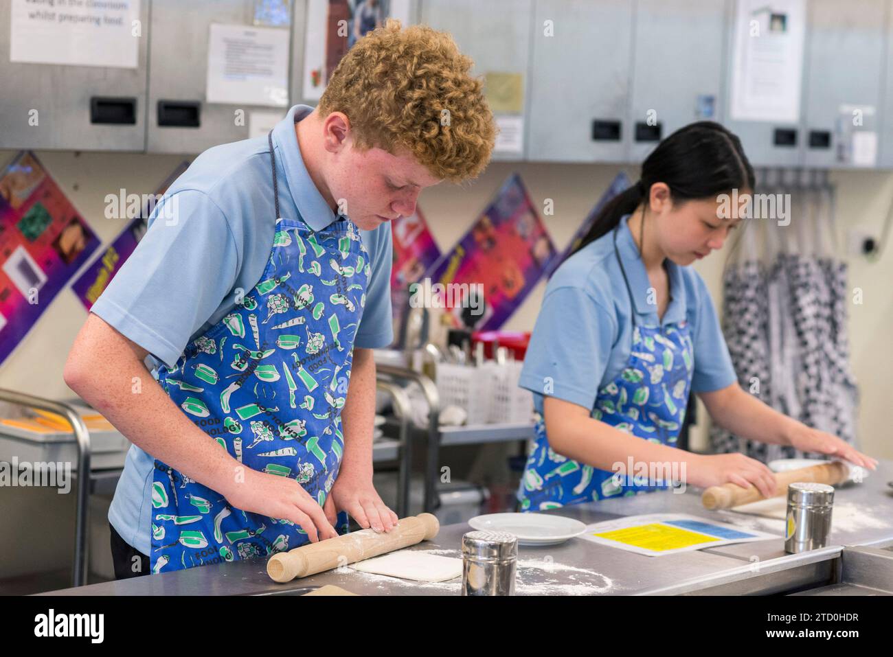 Students studying food technology for GCSE and working preparing food ...