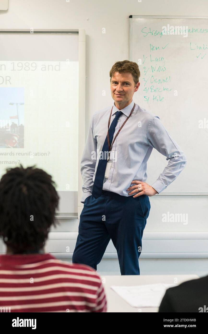 A teacher takes a lecture in a school class room Stock Photo - Alamy