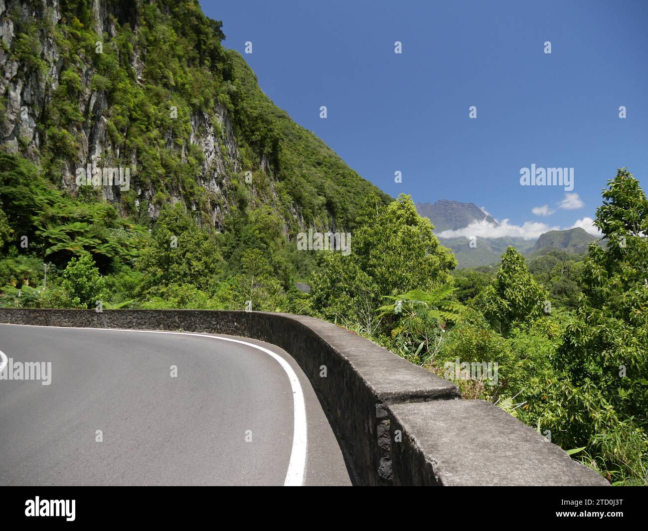 Scenic curved asphalt road to Hellbourg, Salazie circus, Reunion island ...