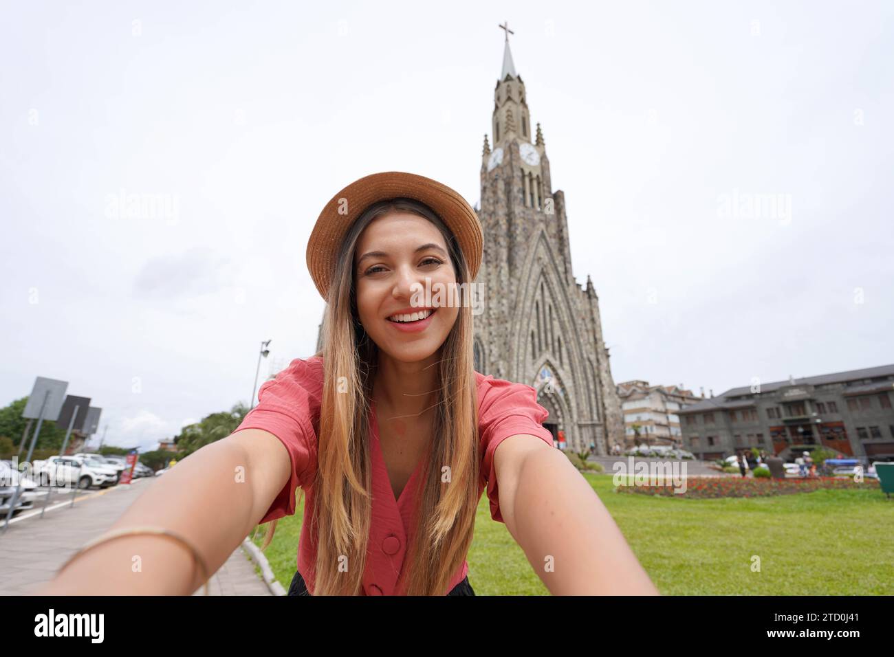 Beautiful young woman takes self portrait with the famous church ...