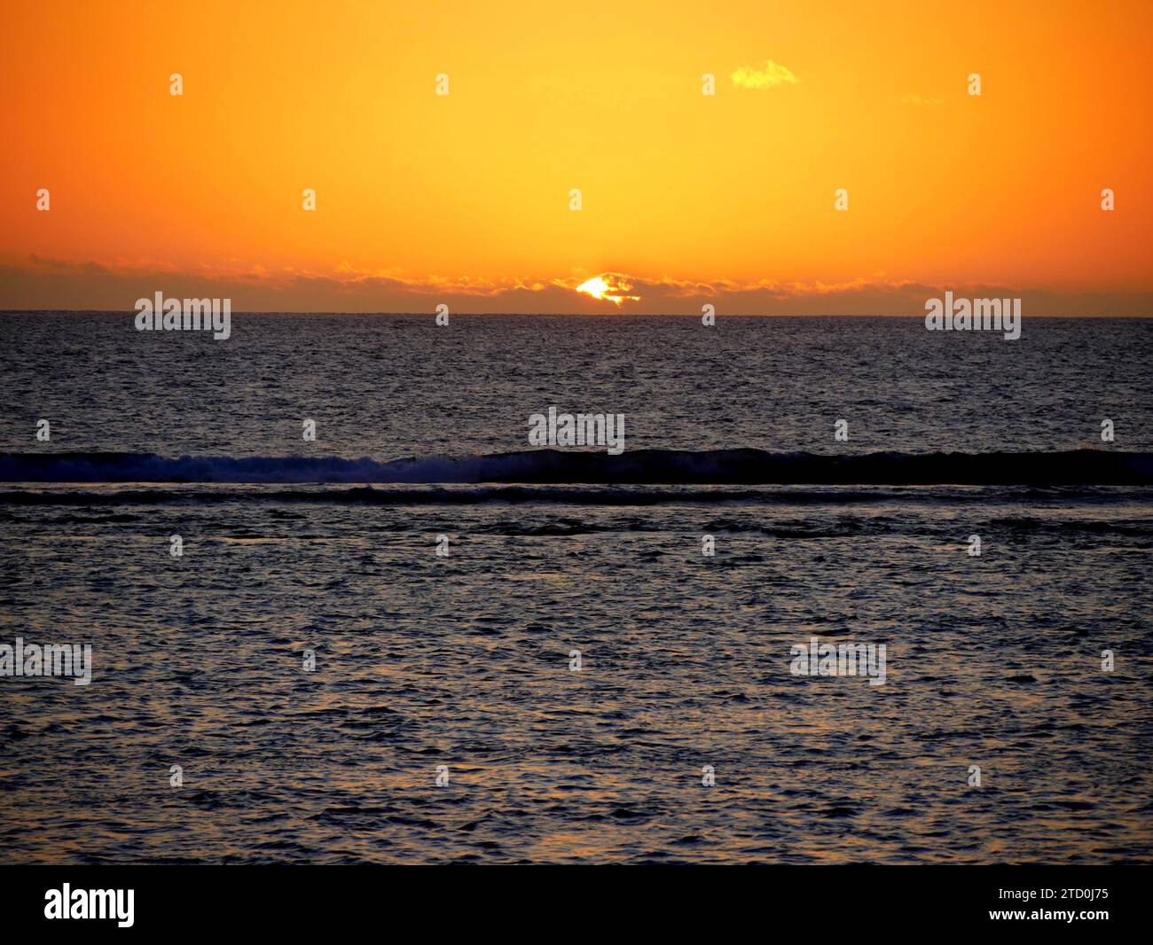 Beautiful sunset over Indian ocean, with orange sky and sun ...