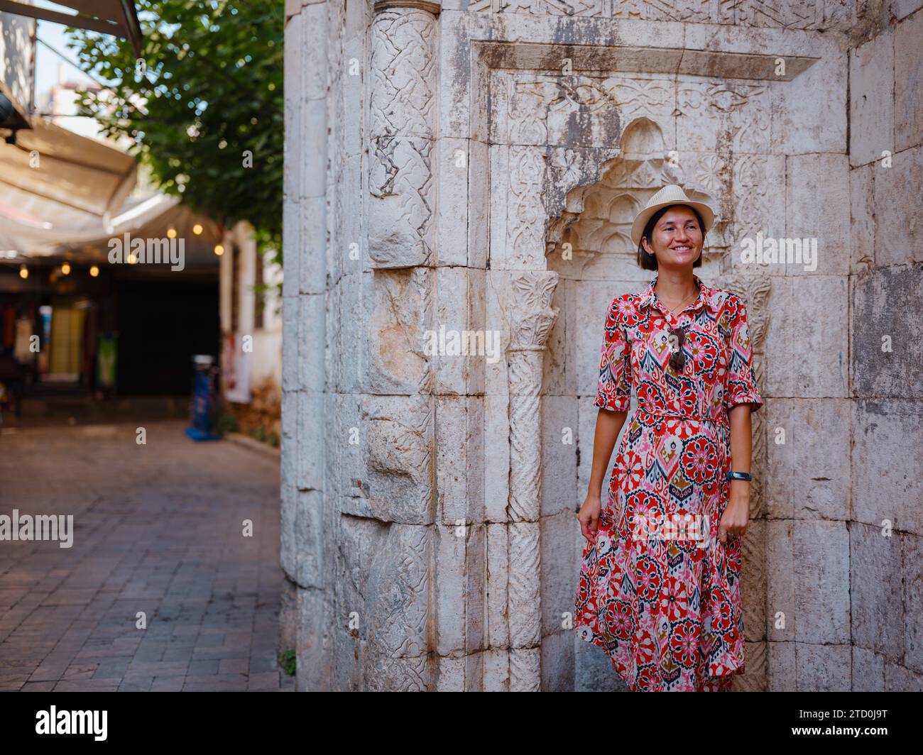 female summer travel to Antalya, Turkey. young asian woman in red dress ...