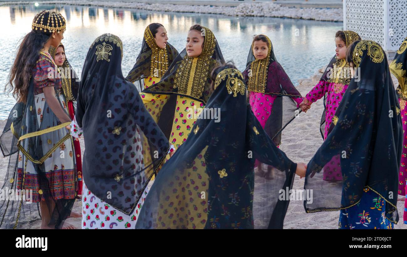 Doha, qatar- December 18, 2023 : Qatari girls in their national attire ...