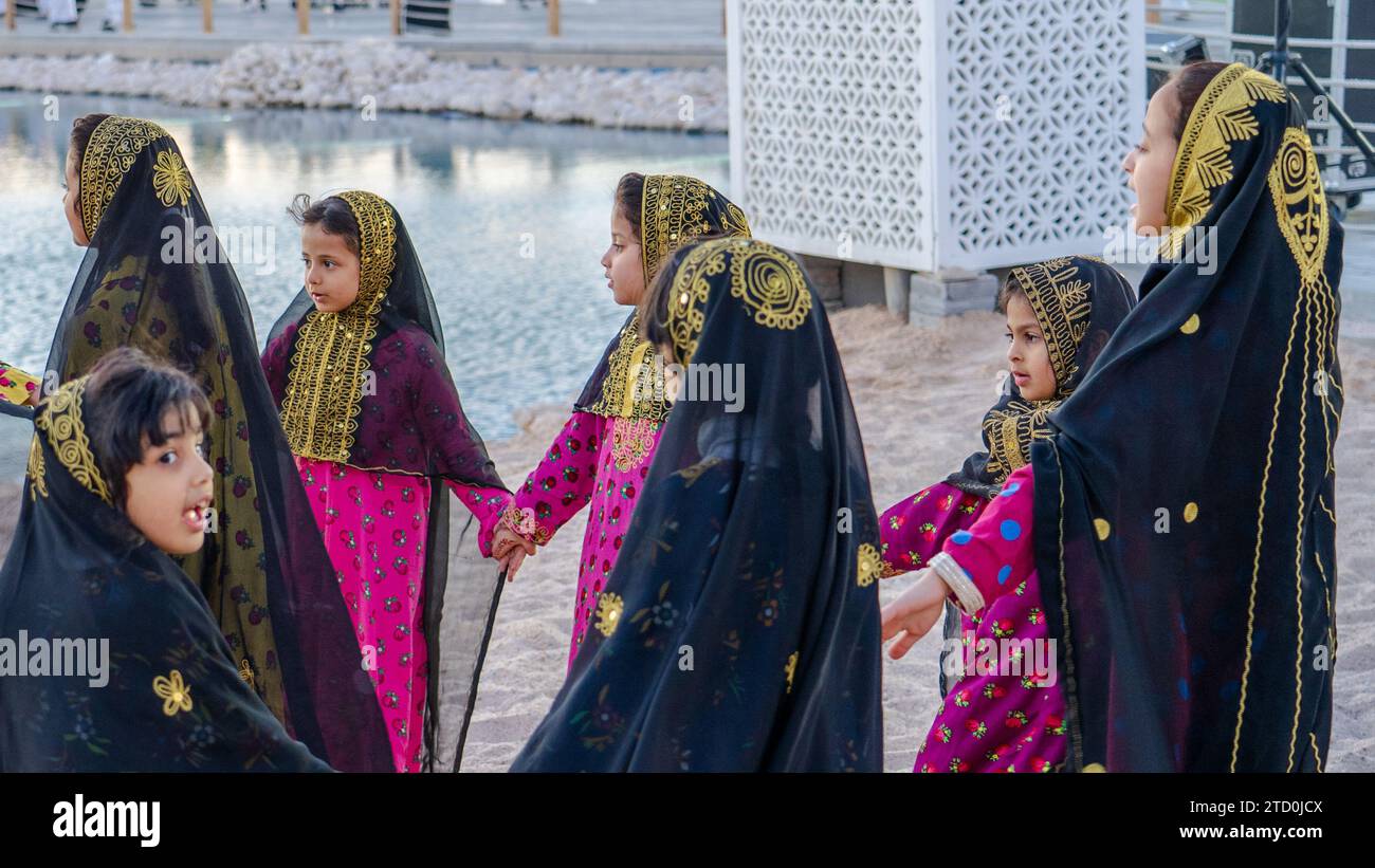 Doha, qatar- December 18, 2023 : Qatari girls in their national attire ...
