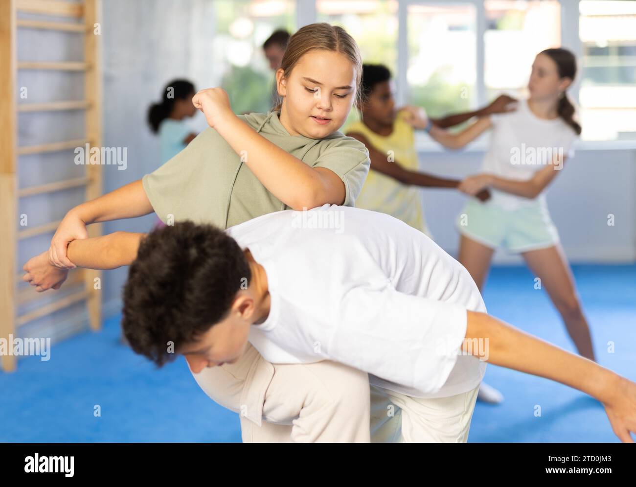 Boy and girl practicing self-defense techniques Stock Photo - Alamy