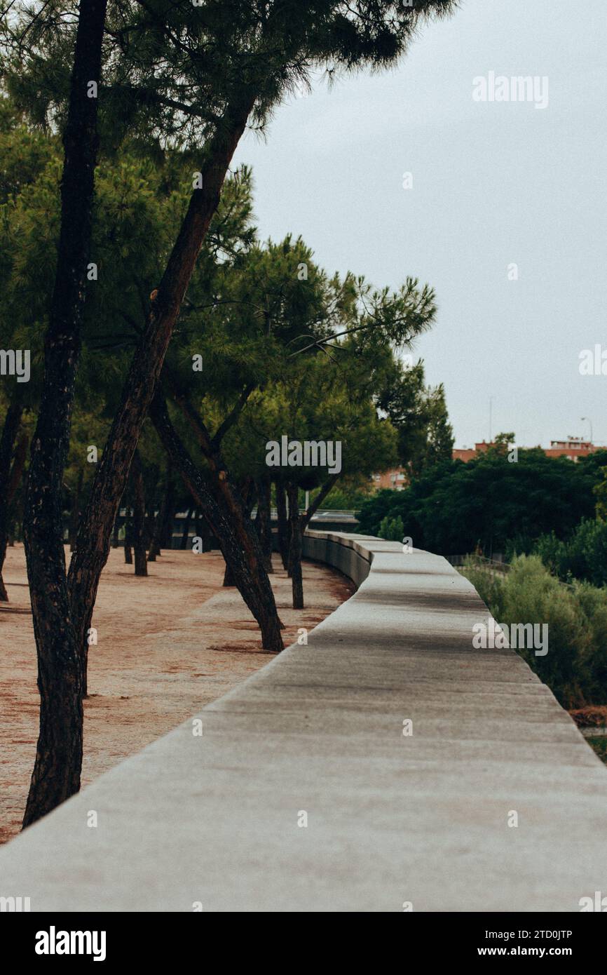 A semi-circular concrete parapet juts out into a distance in a city ...