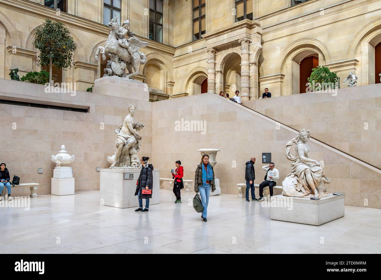 Sculptures in the glass-roofed courtyard known as Cour Marly in the ...