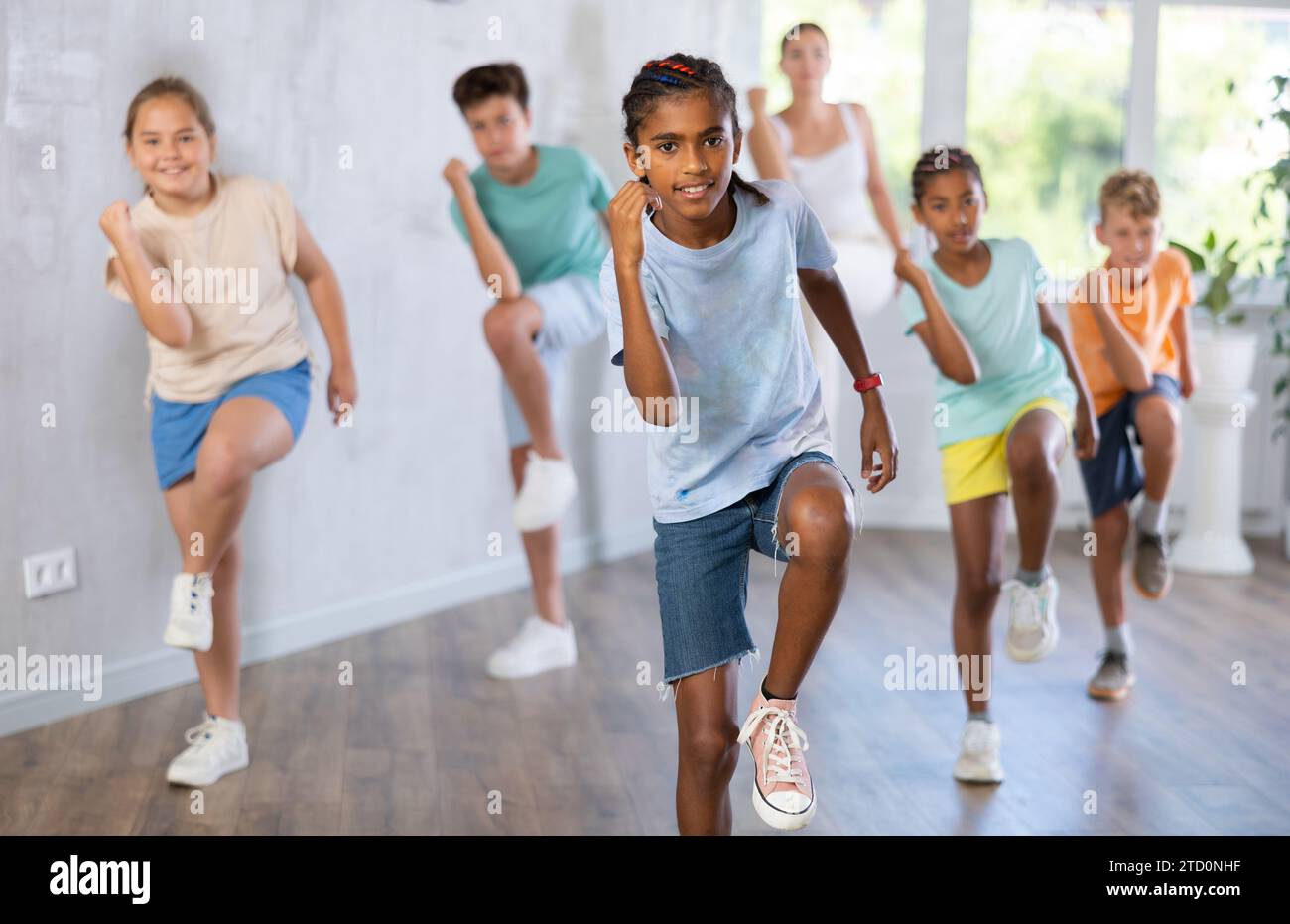 African boy dances vogue in choreographic school, friends and teacher ...