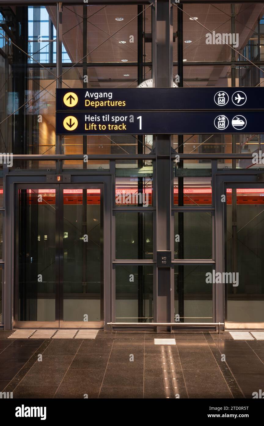 A set of elevators leading up to the departures area of the airport ...