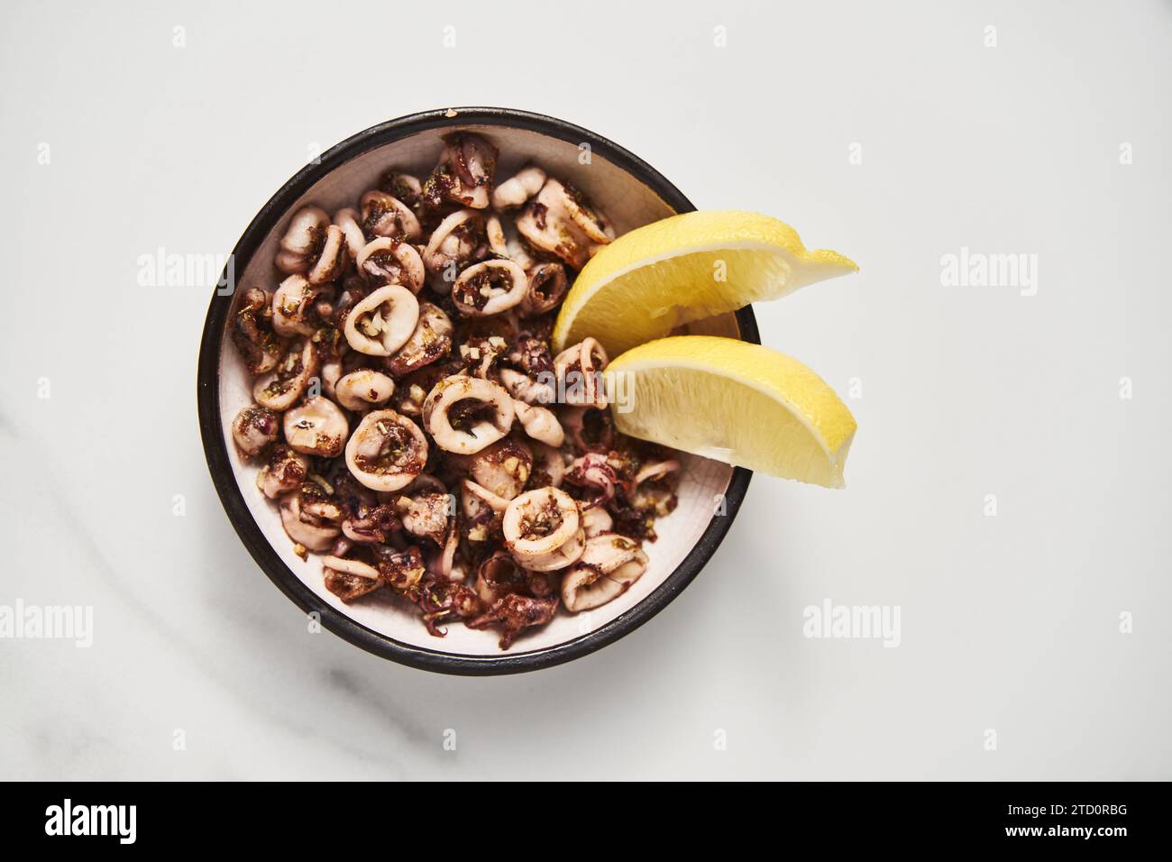 Sauteed Calamari. Baby Calamari cooked with oregano, thyme and garlic ...