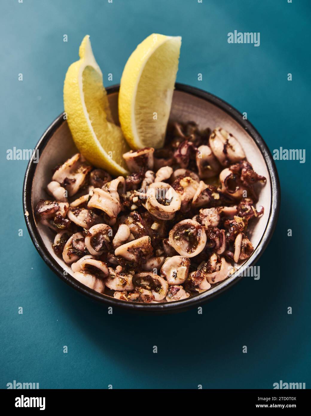 Sauteed Calamari. Baby Calamari cooked with oregano, thyme and garlic ...