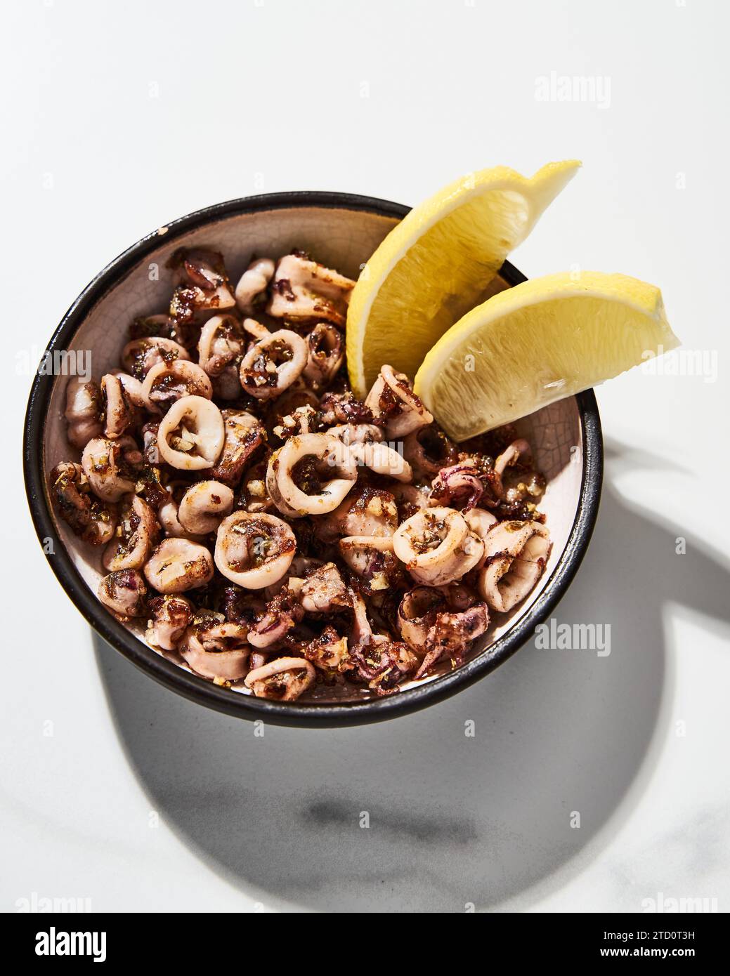 Sauteed Calamari. Baby Calamari cooked with oregano, thyme and garlic ...