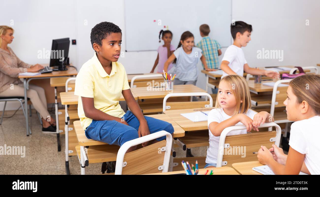 Children pupils talking during recess between lessons Stock Photo - Alamy