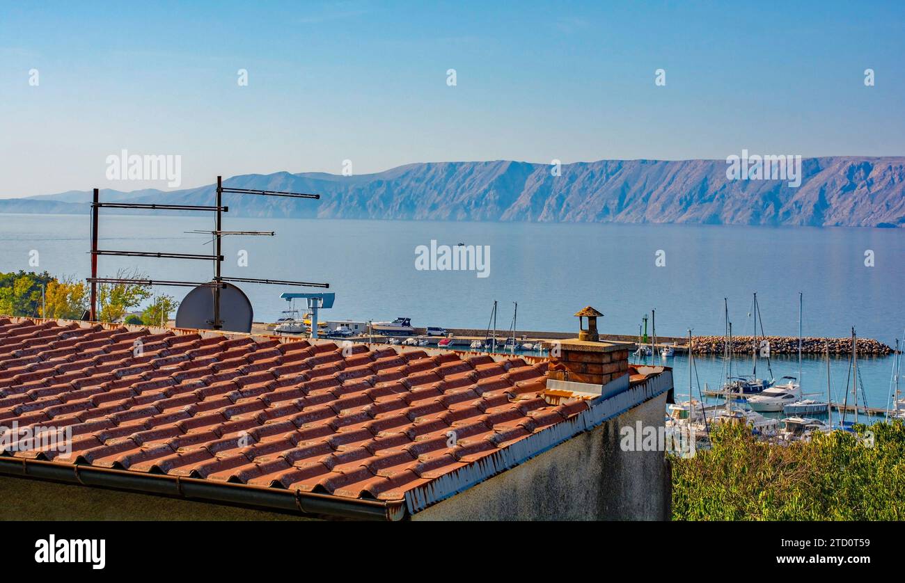A view of the port area over the rooftops in Novi Vinodolski, Primorje ...