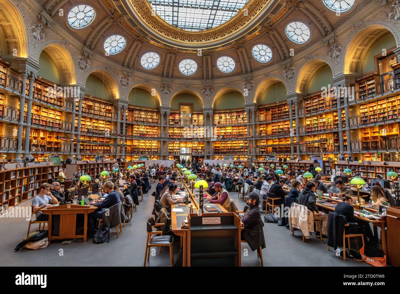 People reading and studying the books at The magnificent Oval reading ...