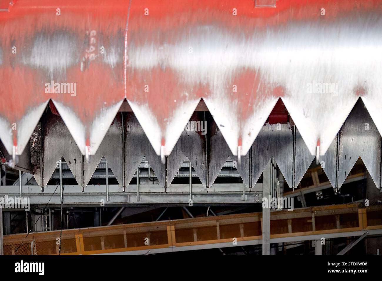 Detalied view of jaws of red grab. Handling and Transportation of fuel ...