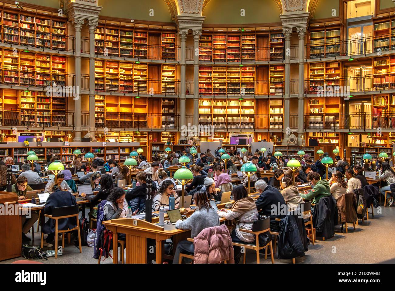 People reading and studying the books at The magnificent Oval reading ...