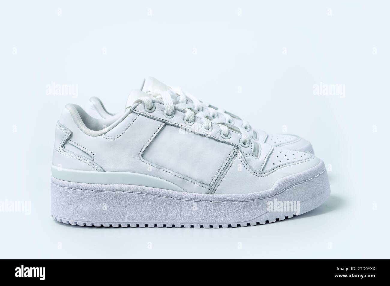 White tennis shoes isolated on white background Stock Photo - Alamy