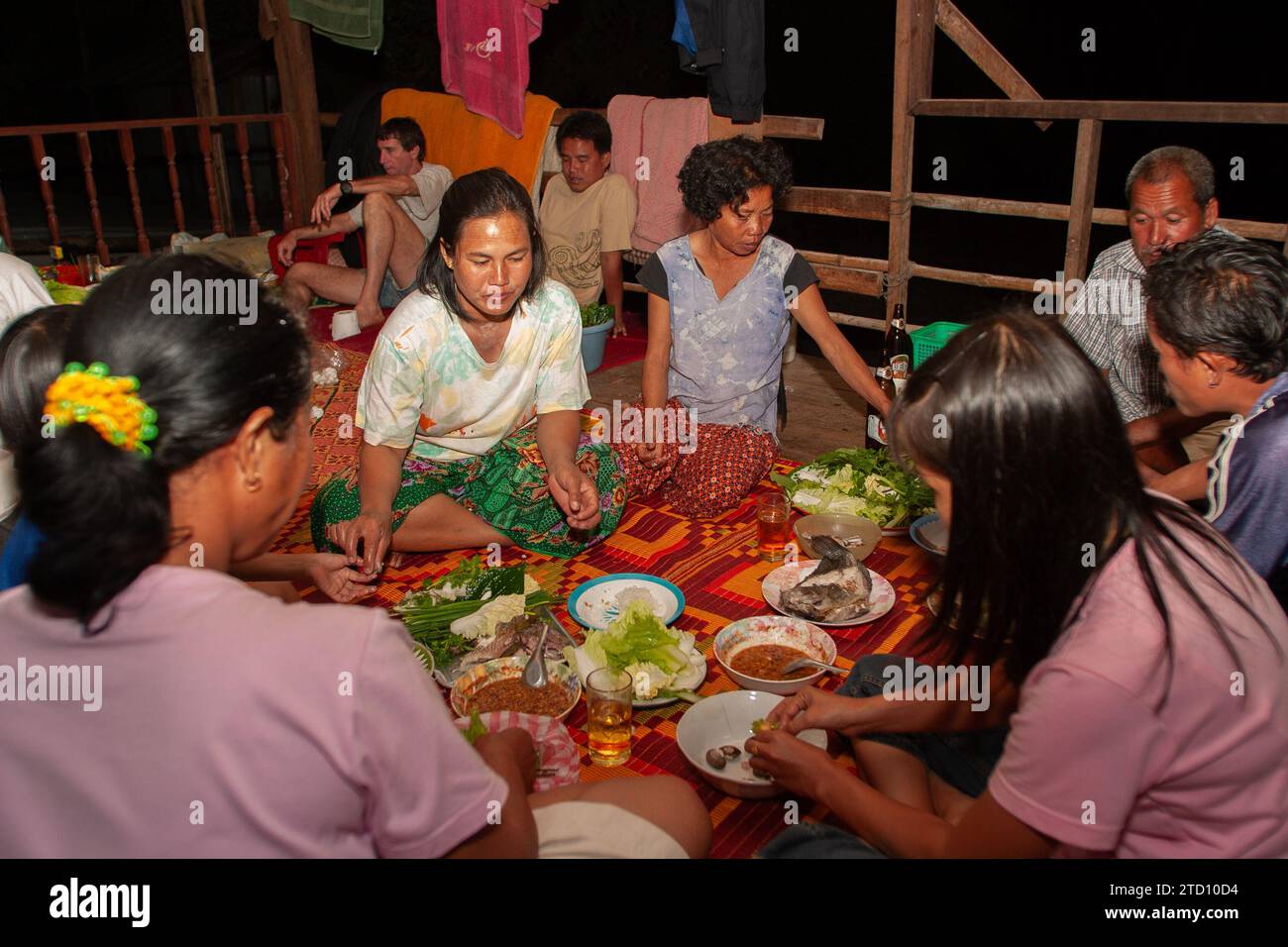 Family meal in a village in northern Thailand in the province of Isan ...
