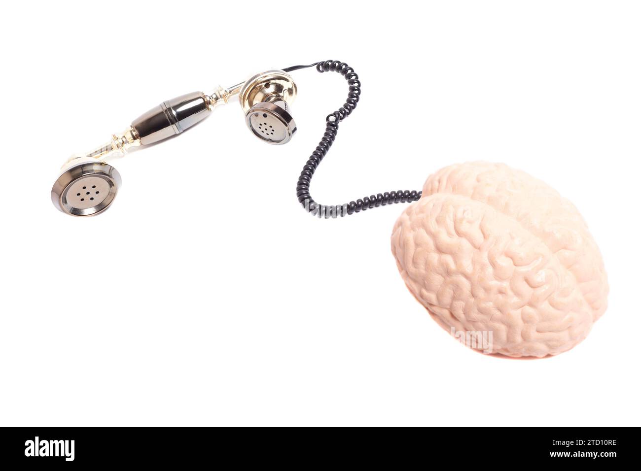 Vintage telephone receiver with human brain anatomical model isolated ...