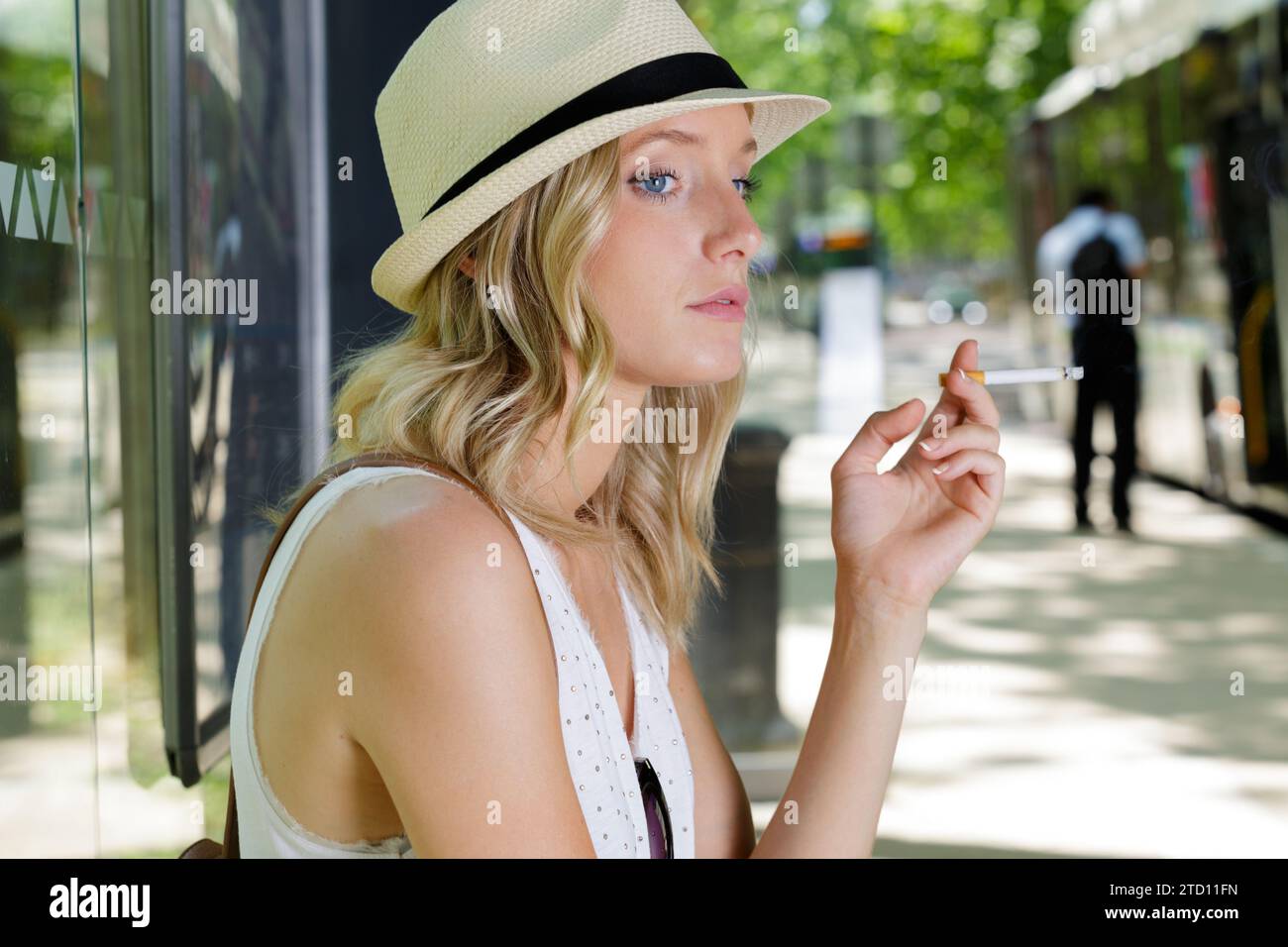 a young woman smoking cigarette outdoor Stock Photo - Alamy