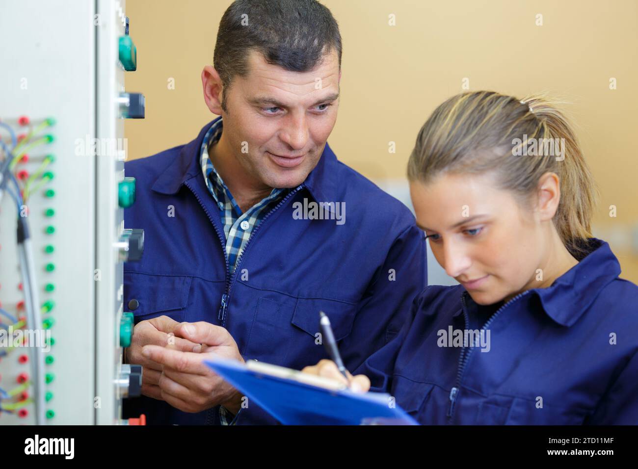 two workers operators in factory Stock Photo - Alamy
