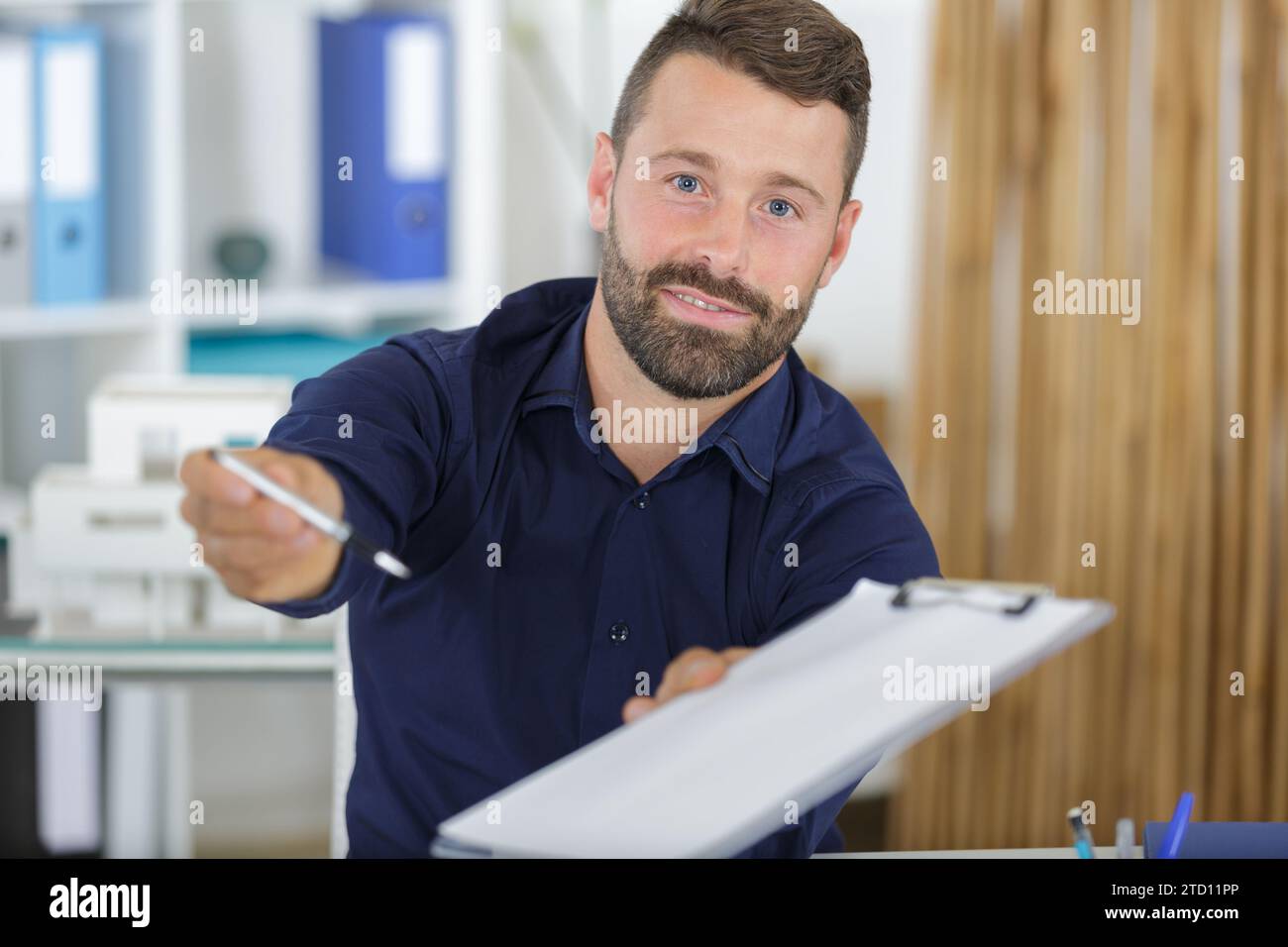 young man showing his pen Stock Photo - Alamy